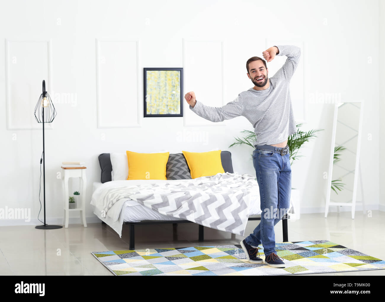 Handsome young man dancing at home Stock Photo - Alamy