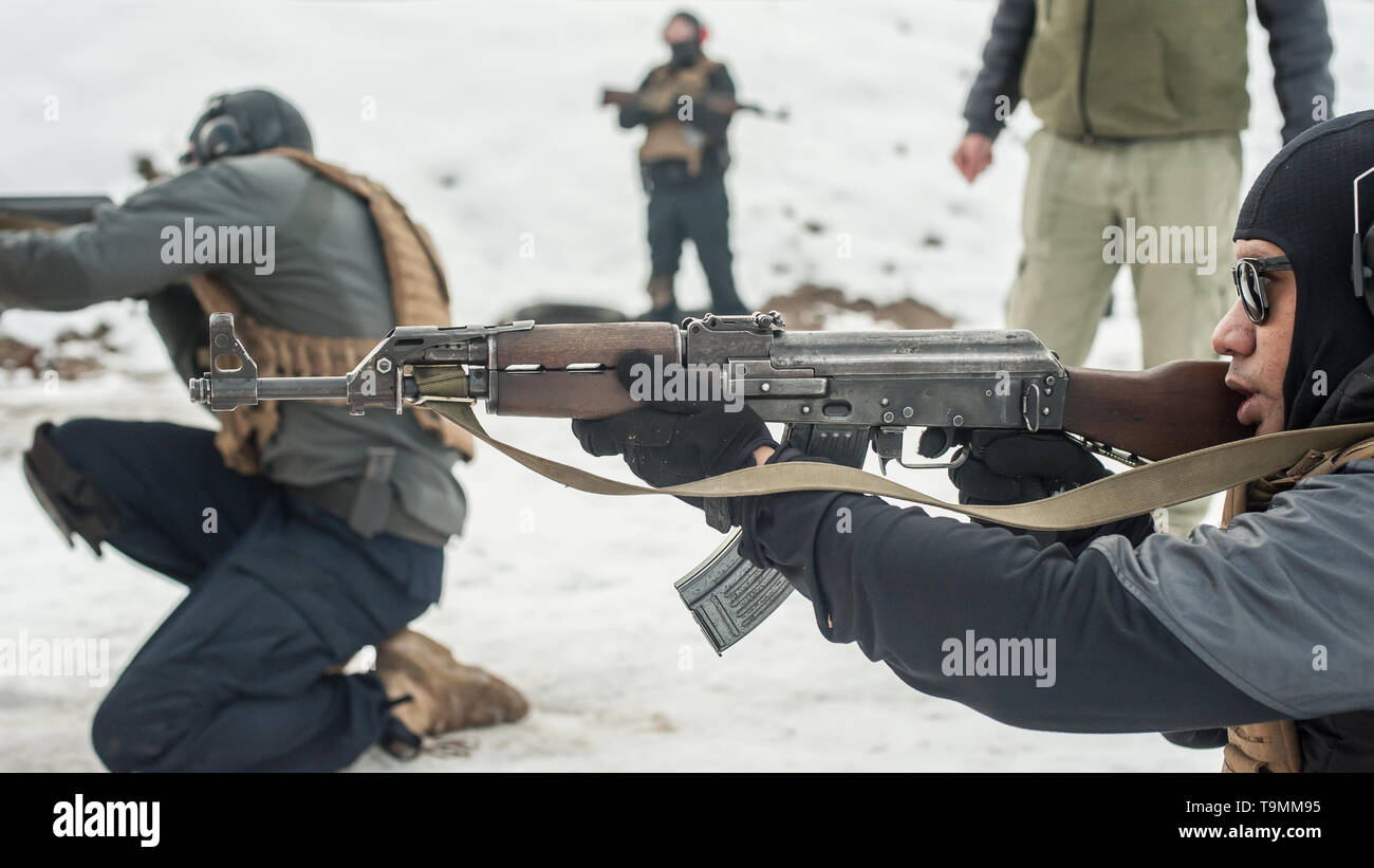 Special forces action shooting and moving defensive rifle firearm use ...