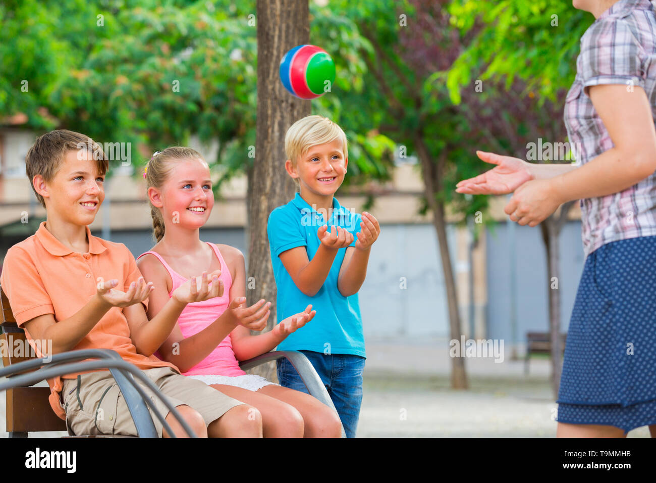 Children are playing ball on the playground Stock Photo - Alamy