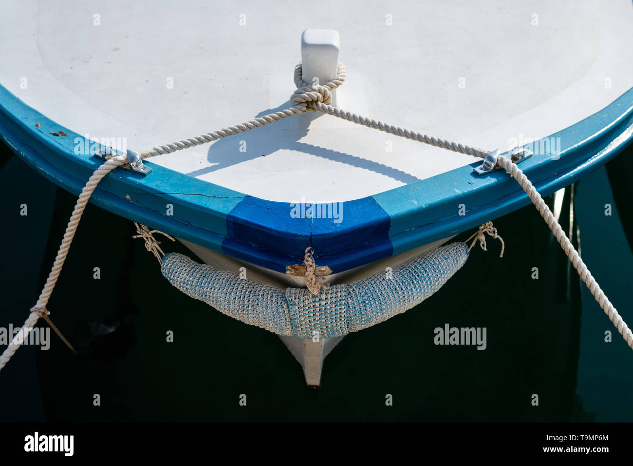 Bow of a small white fishing boat with ropes in Croatia Stock Photo - Alamy