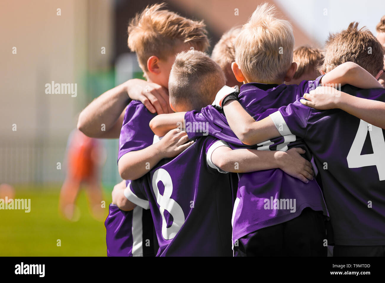 Group of children in soccer football team standing together before the ...