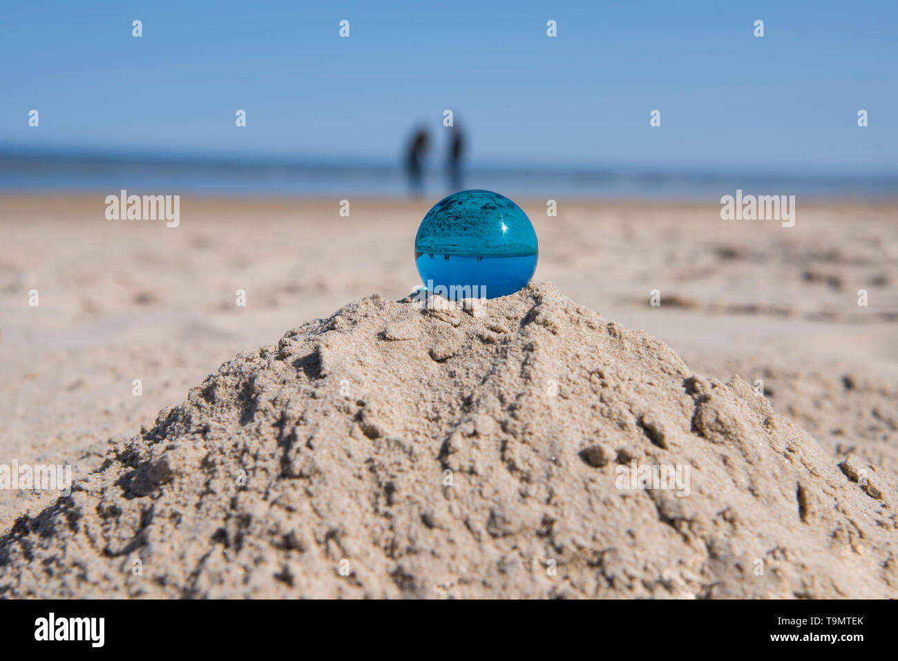 Glass sphere at the beach. Sunny summer day Stock Photo - Alamy