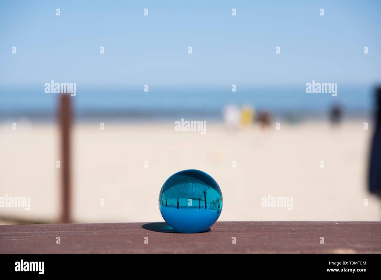 Glass sphere at the beach. Sunny summer day Stock Photo - Alamy