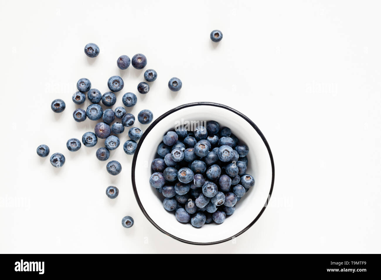 Blueberries in bowl isolated on white background, table top view Stock ...