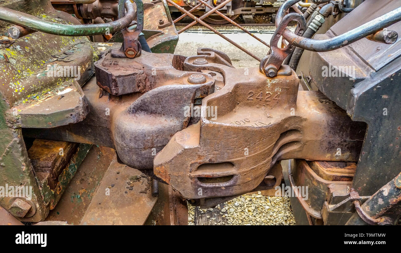 Train couplings linked together in a train yard Stock Photo - Alamy