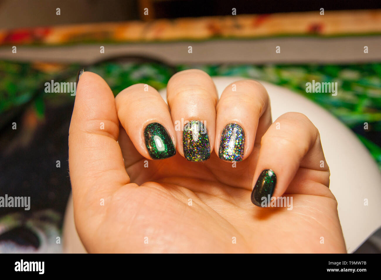 Women's hands - beautiful green manicure, nail polish on nails of ...