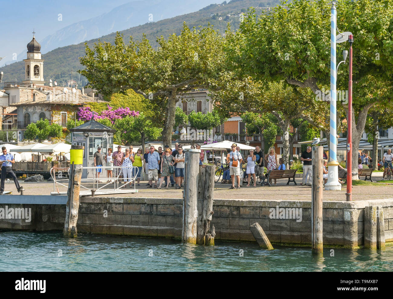 TORRI DEL BENACO, LAKE GARDA, ITALY - SEPTEMBER 2018: People waiting ...