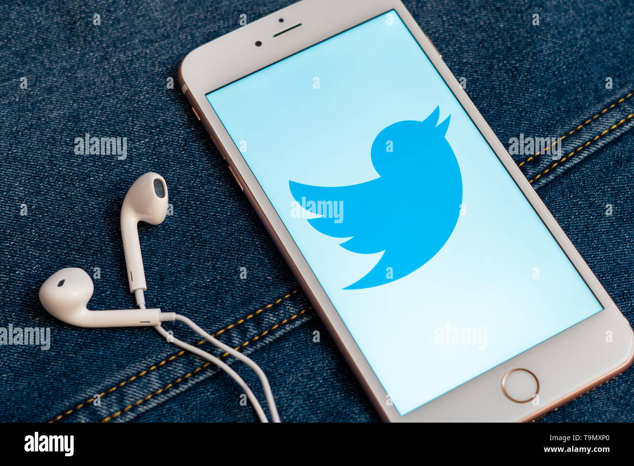 White iPhone with logo of social media Twitter on the screen. Social ...