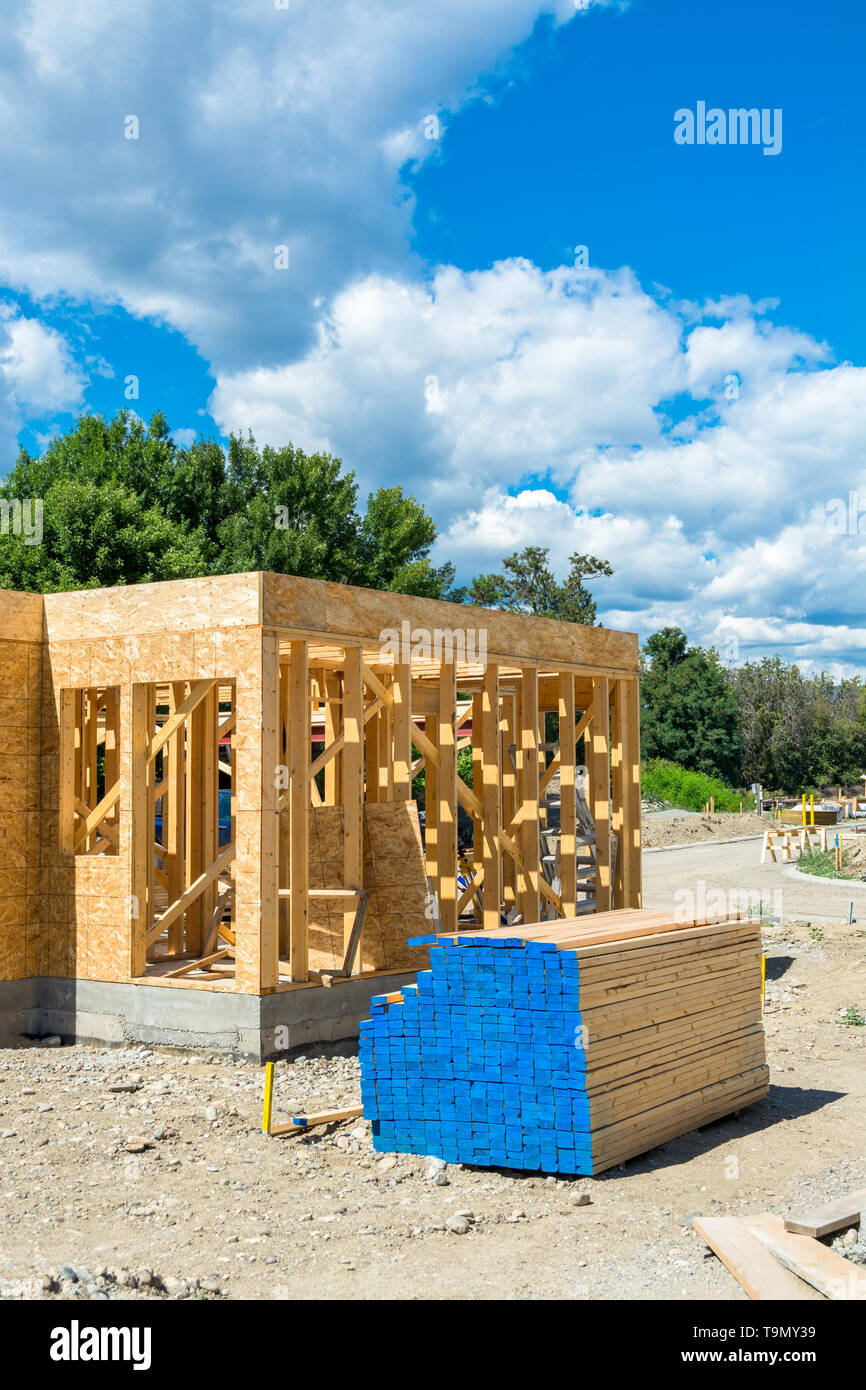 Wooden frame of new building with lumber materials prepared for ...