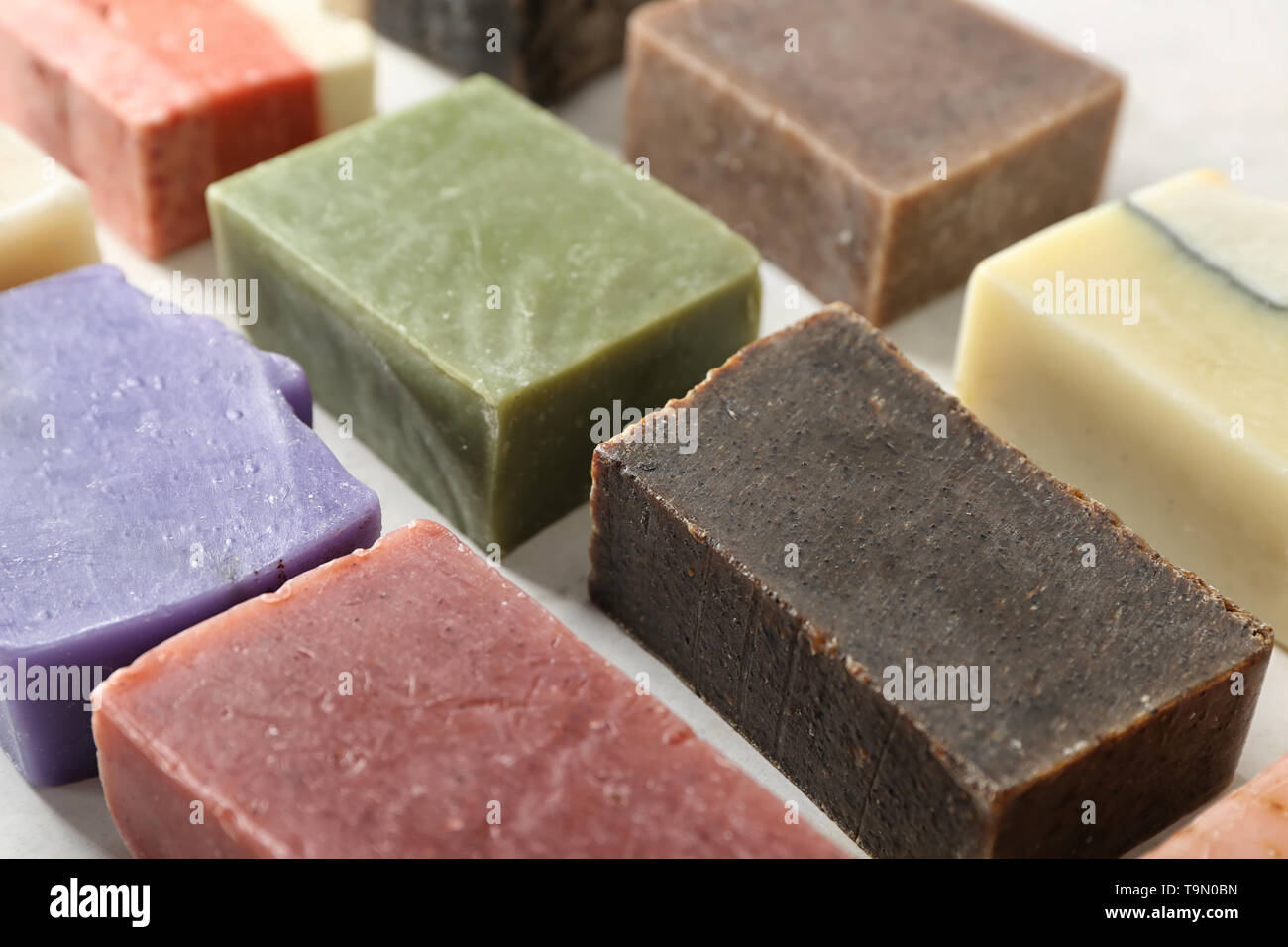 Different soap bars on light table Stock Photo - Alamy