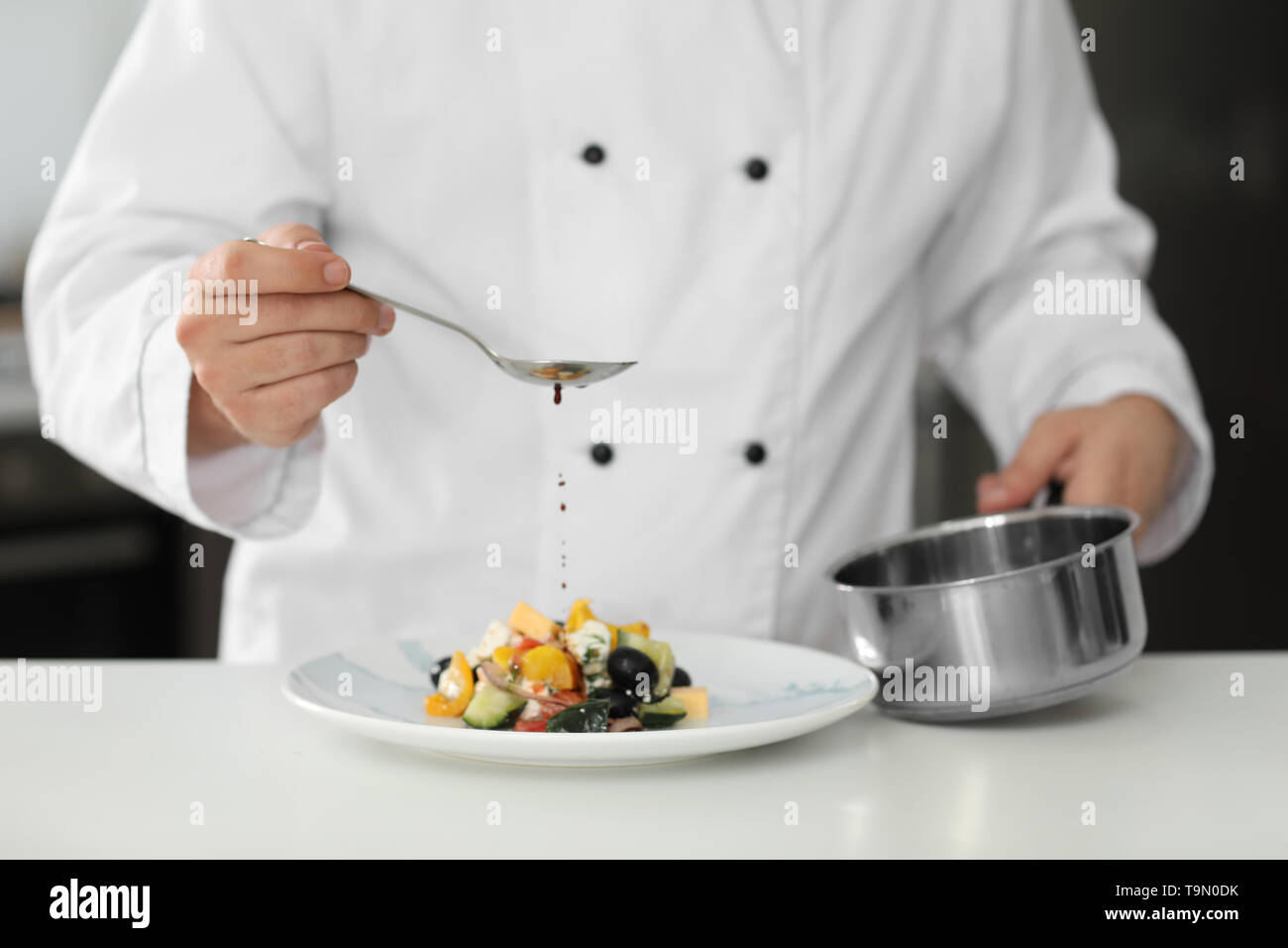 Male chef dressing tasty hi-res stock photography and images - Alamy