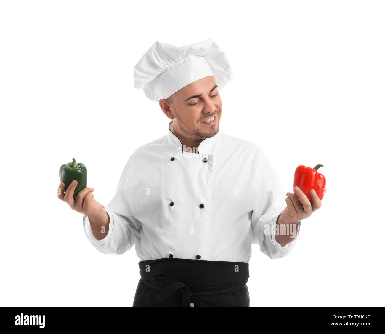 Male chef with peppers on white background Stock Photo - Alamy