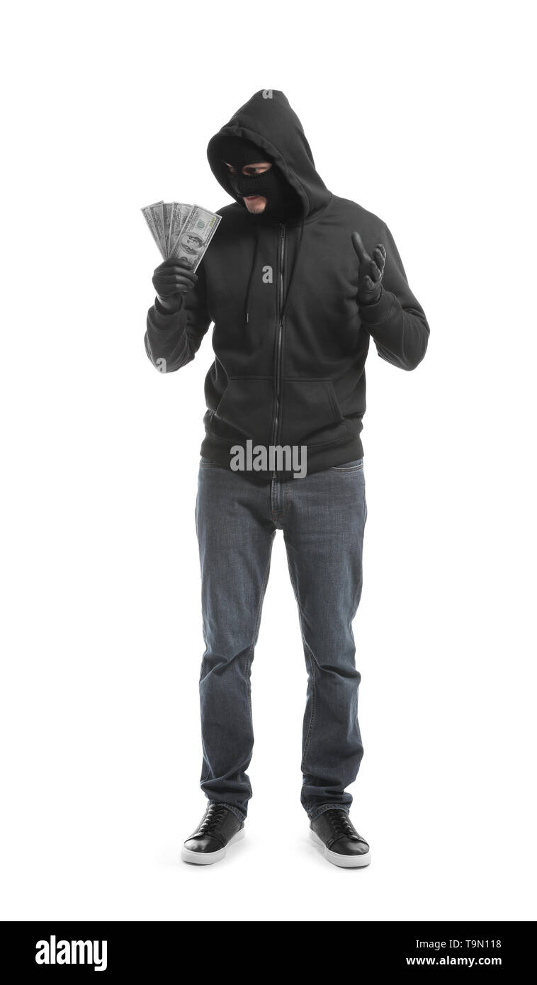 Male thief with money on white background Stock Photo - Alamy