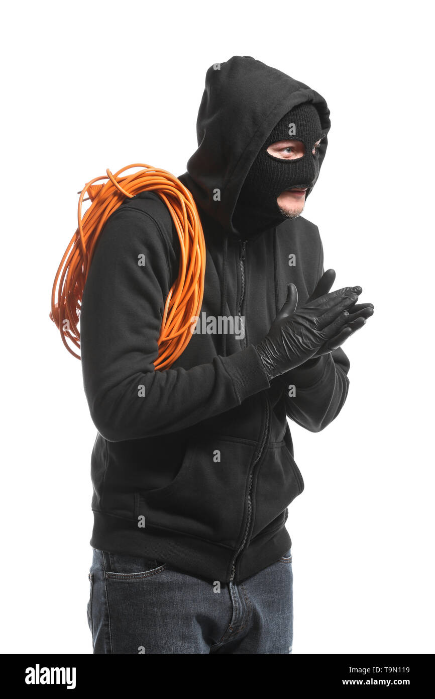 Male thief with rolled cable on white background Stock Photo - Alamy