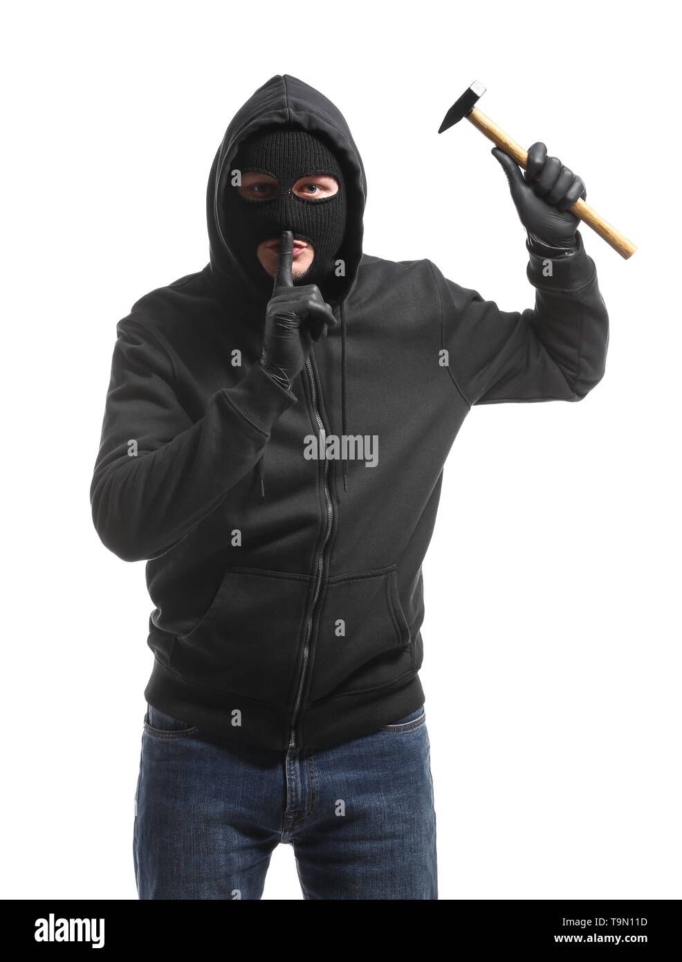 Male thief with hammer showing silence gesture on white background ...