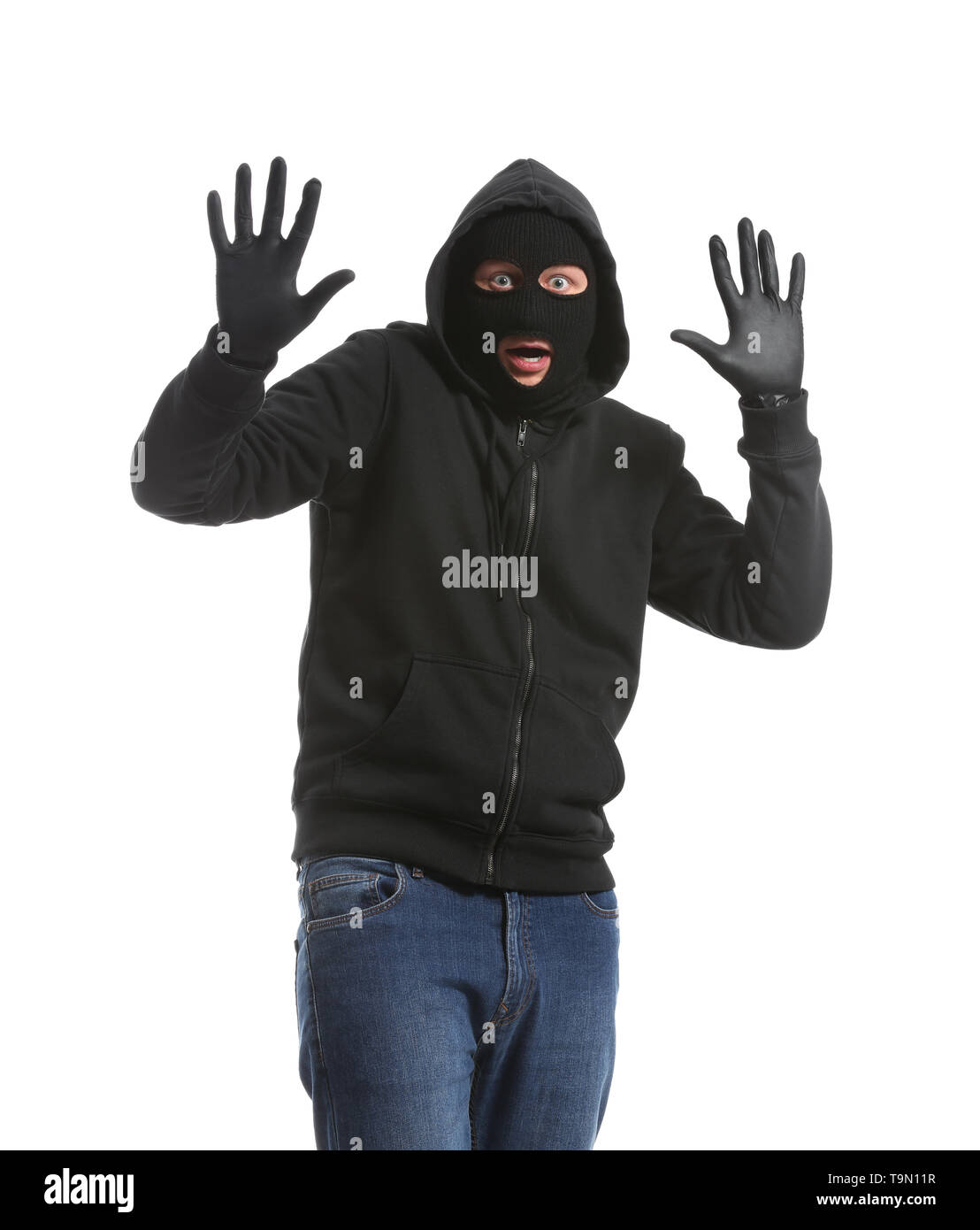 Male thief with raised hands on white background Stock Photo - Alamy