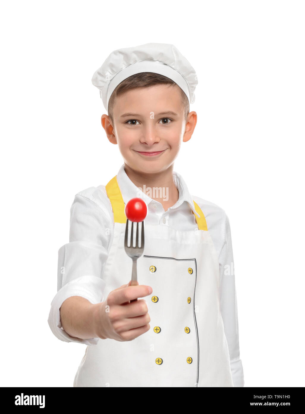 Cute little chef with tomato on fork against white background Stock ...