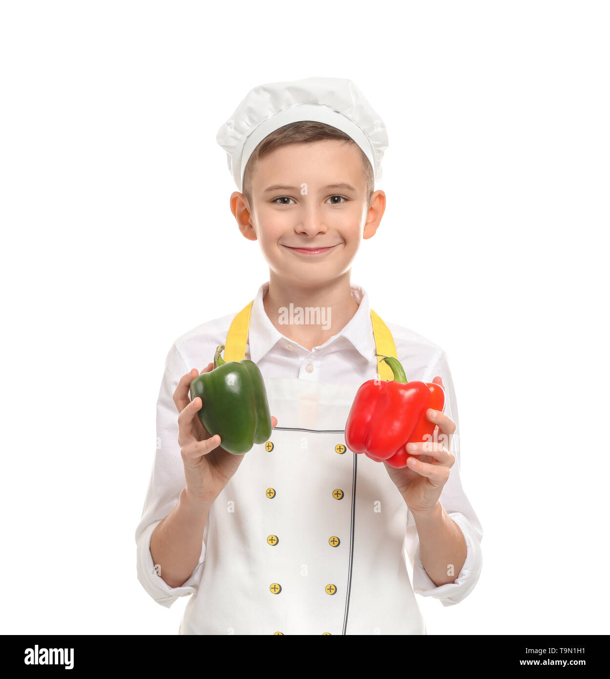 Cute little chef with peppers on white background Stock Photo - Alamy