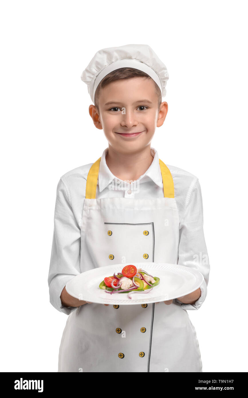 Cute little chef with salad on white background Stock Photo - Alamy