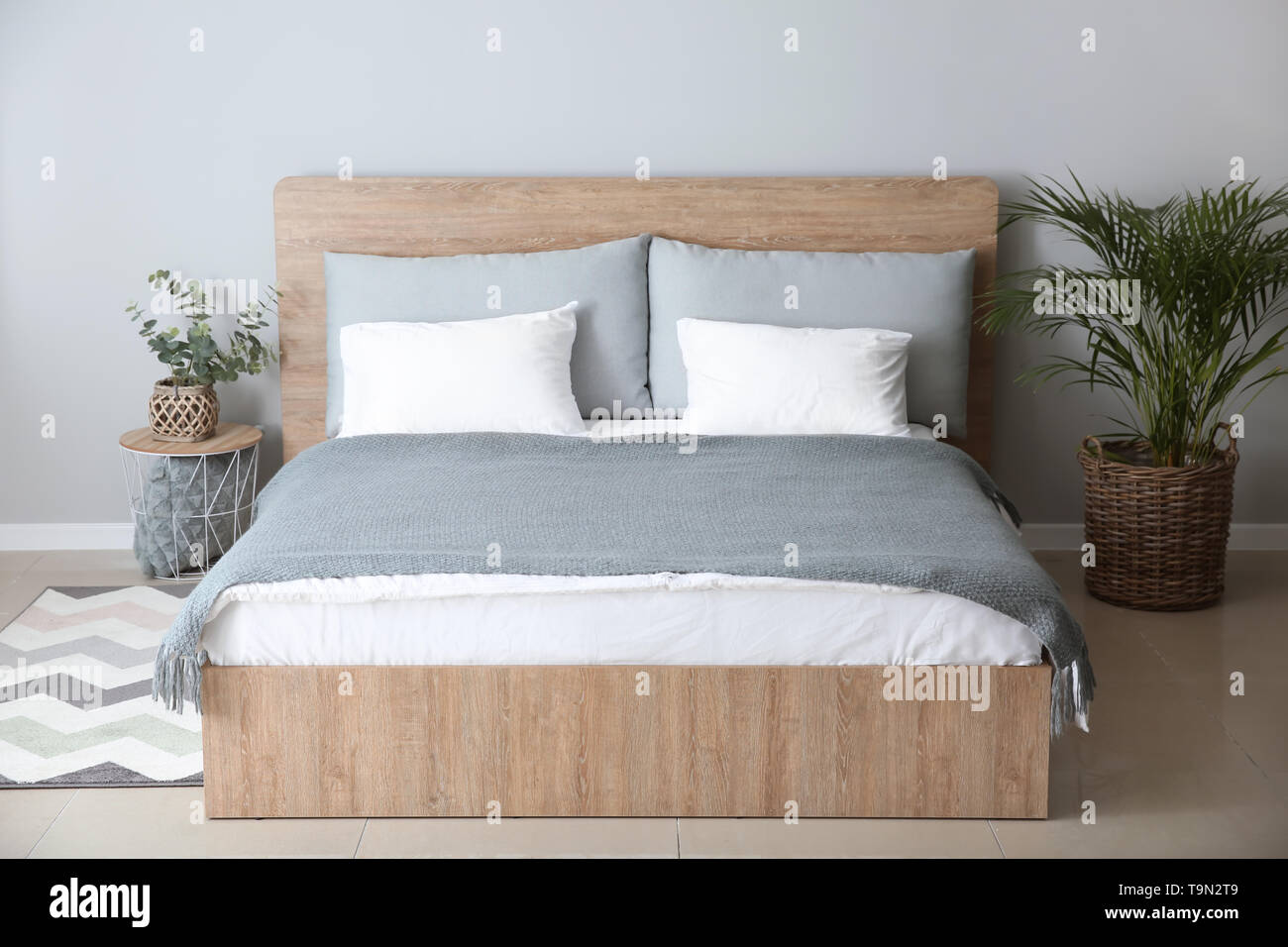 Big bed in interior of room Stock Photo - Alamy