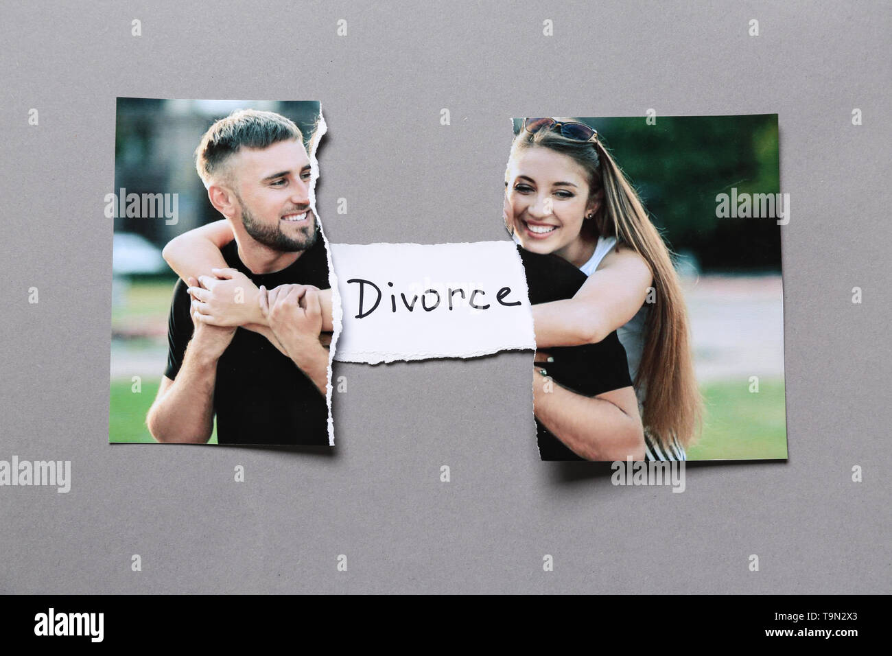 Torn photo of happy couple on grey background. Concept of divorce Stock Photo - Alamy