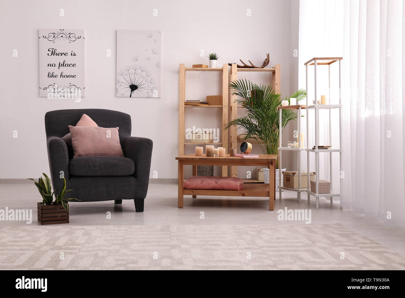 Interior of modern room with table and comfortable armchair Stock Photo ...