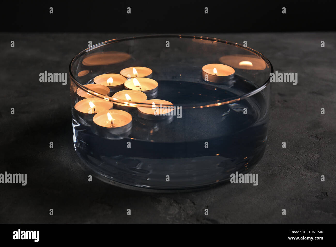 Glass bowl floating candles hi-res stock photography and images - Alamy