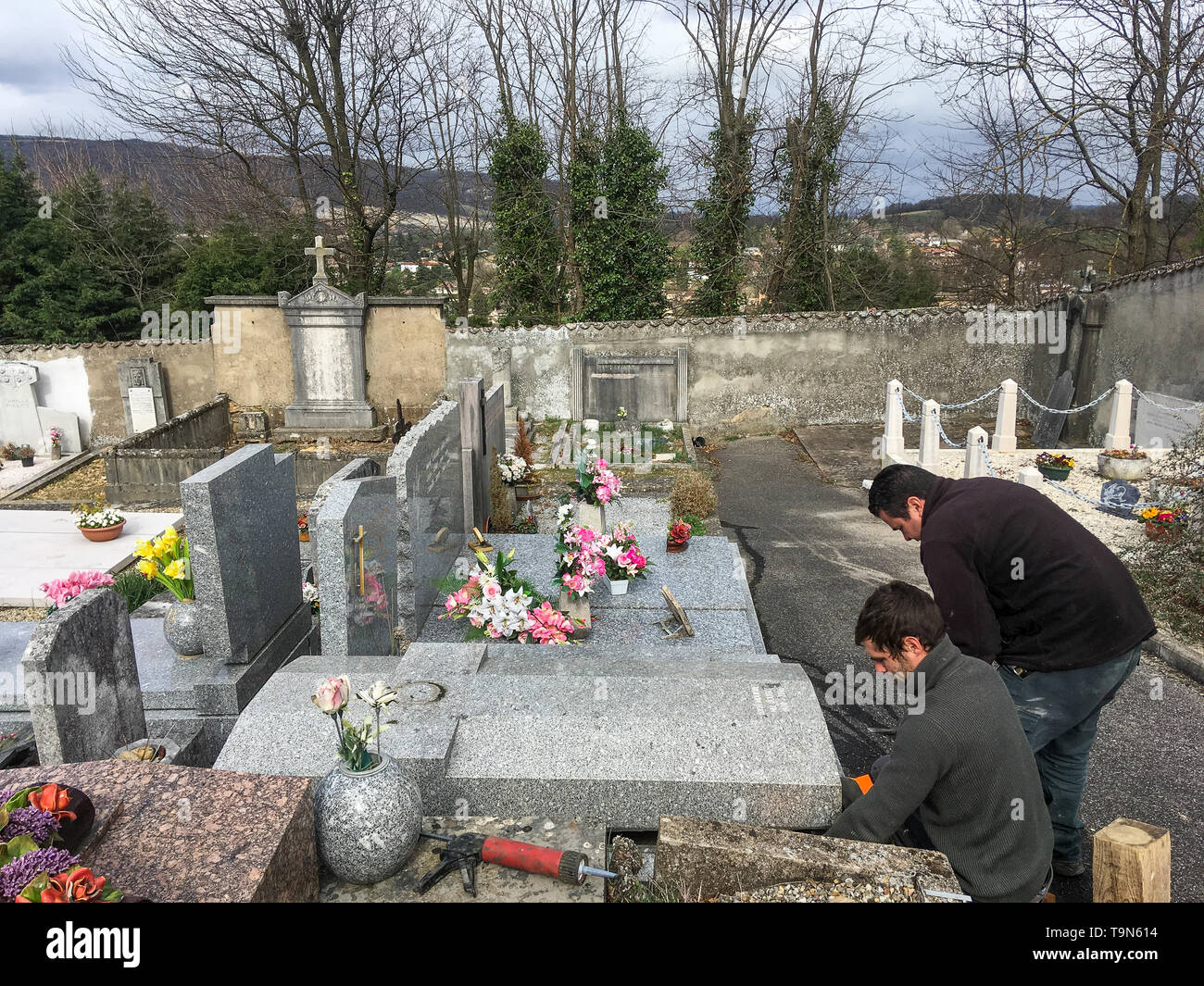 Marble workers at work in a cemetry, Fontaine-sur-Saône, Rhône, France ...