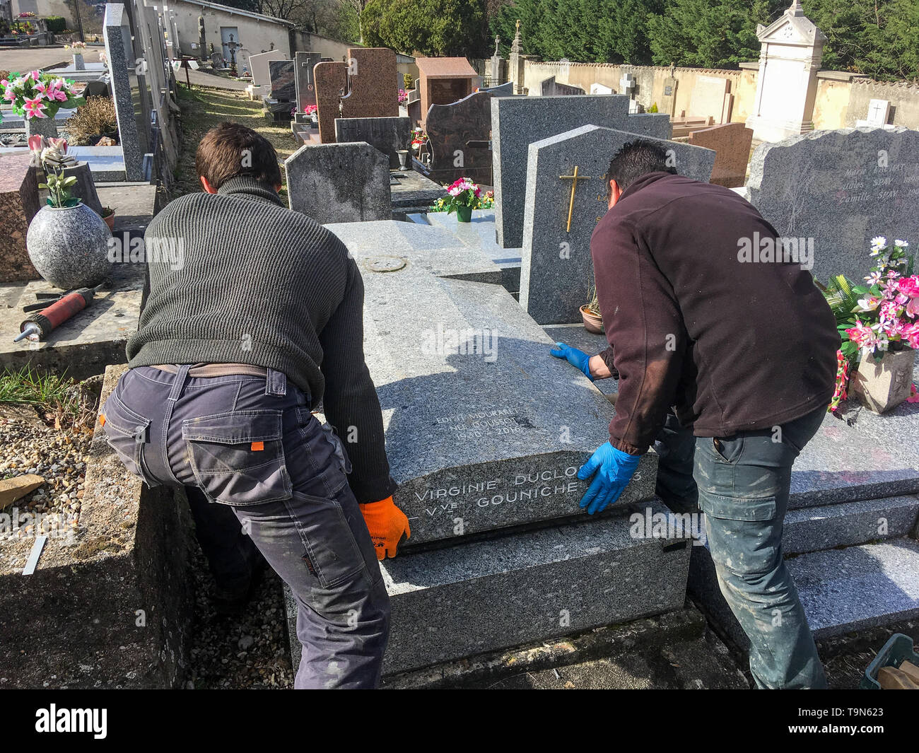 Marble workers at work in a cemetry, Fontaine-sur-Saône, Rhône, France ...