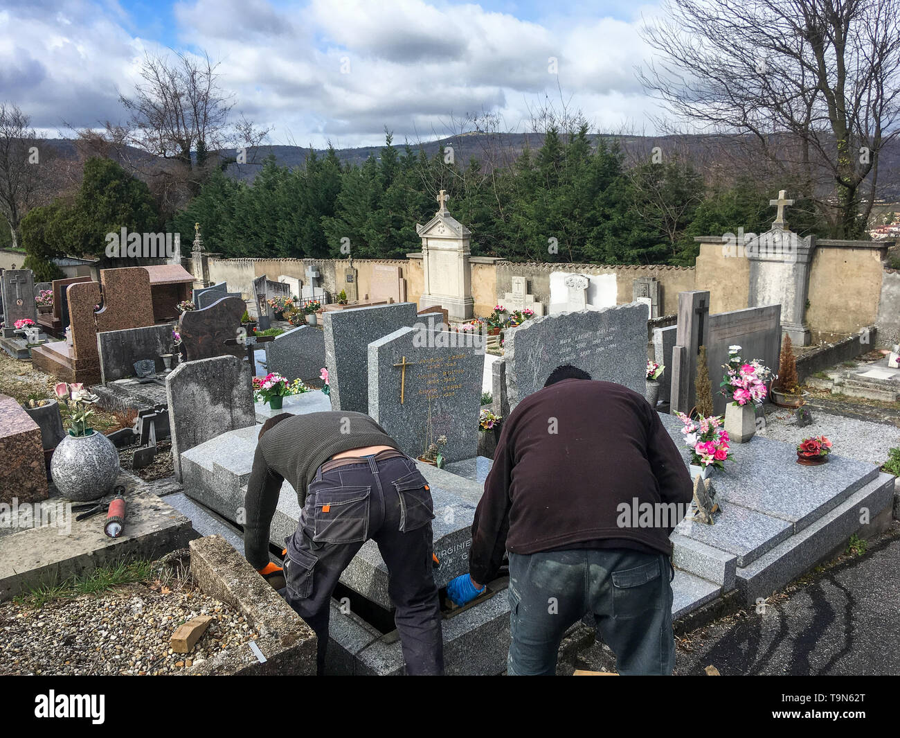 Marble workers at work in a cemetry, Fontaine-sur-Saône, Rhône, France ...