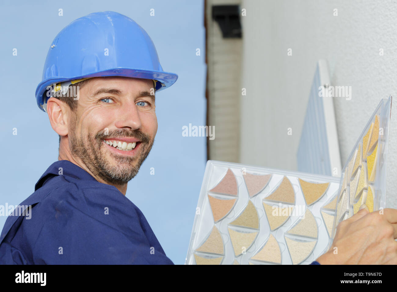 choosing tiles at work Stock Photo - Alamy