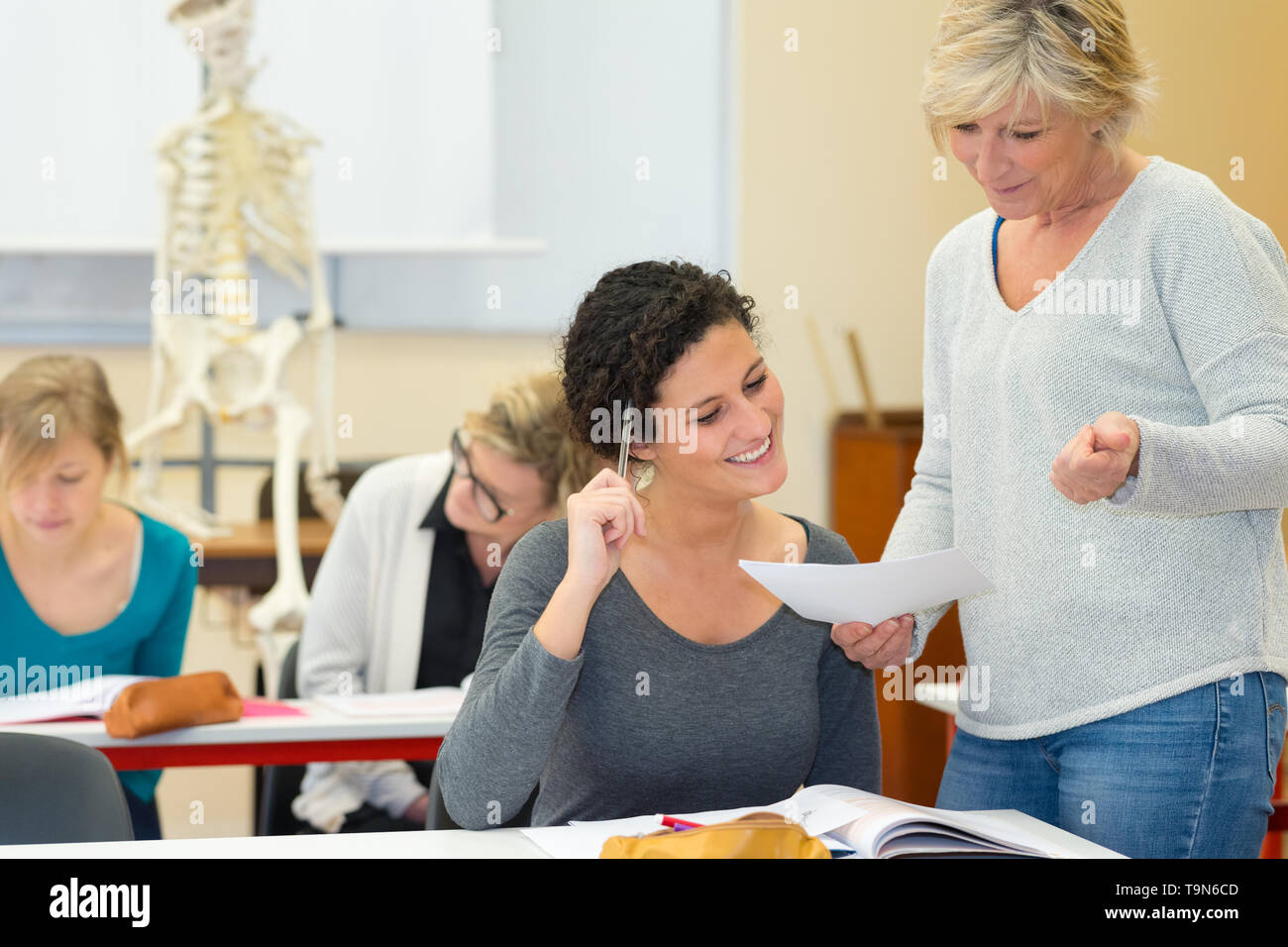 Girl showing exam paper hi-res stock photography and images - Alamy