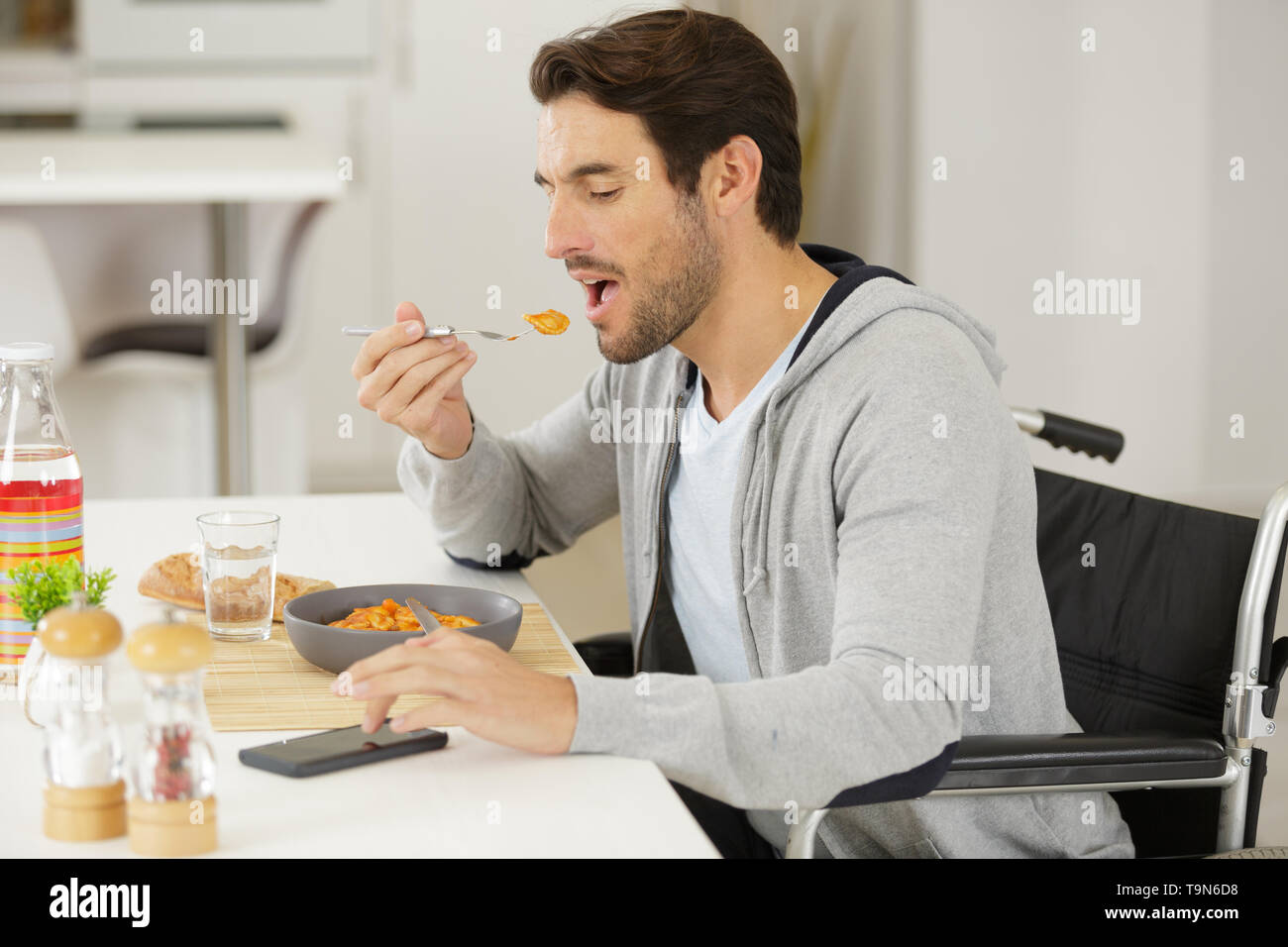 Disabled eating in restaurant hi-res stock photography and images - Alamy