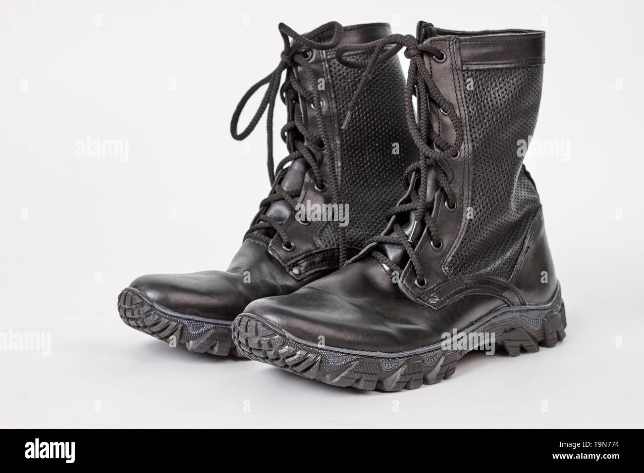 Closeup view of army boots isolated on white background Stock Photo - Alamy