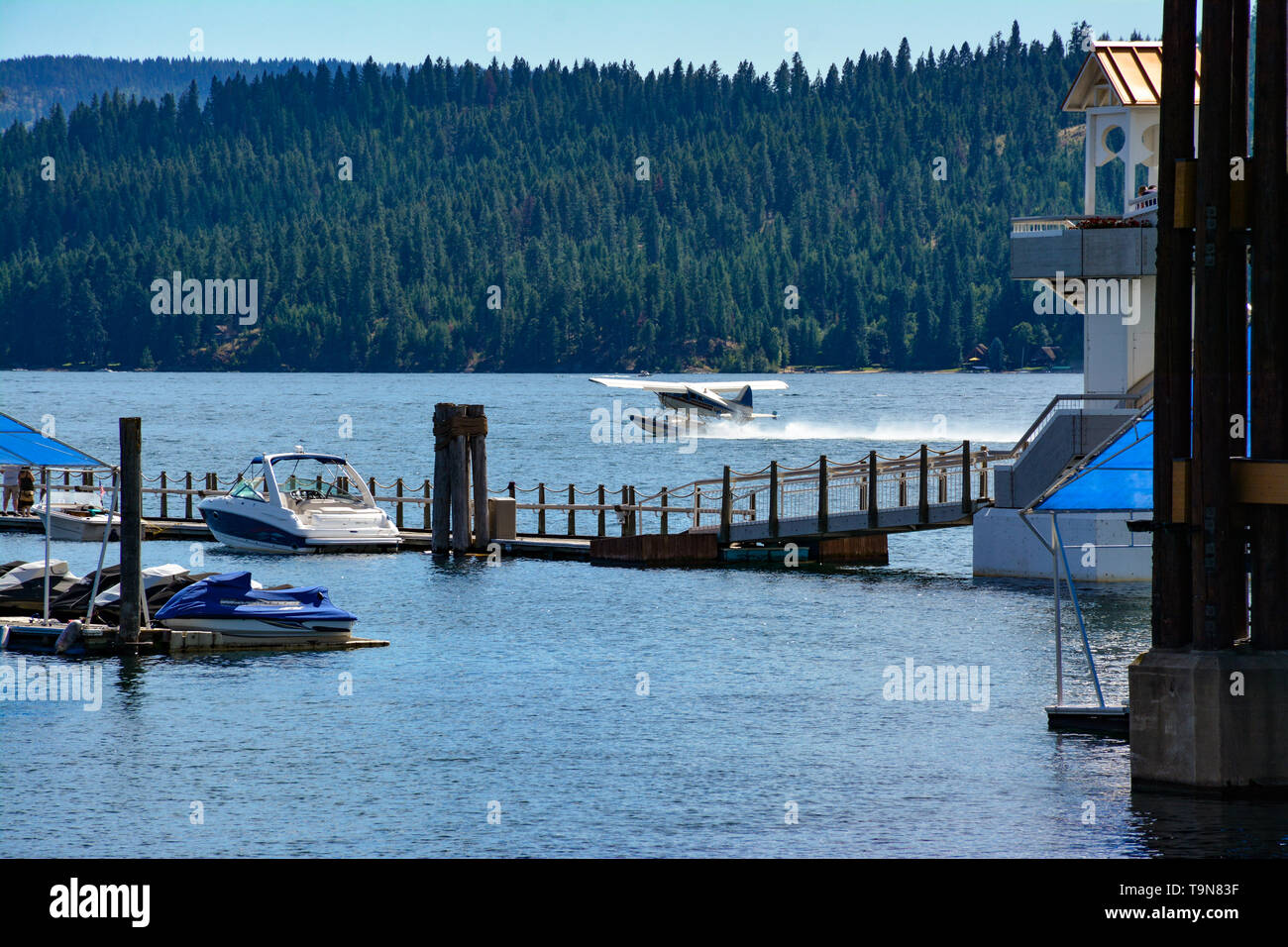 A floatplane readies for take off on Lake Coeur d'Alene, near floating ...