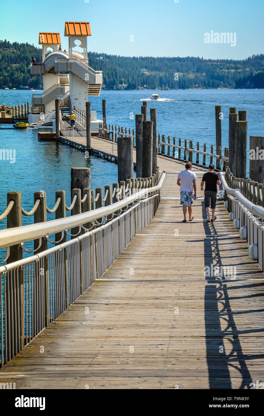 People walking on floating boardwalk around the Marina for the Coeur d ...