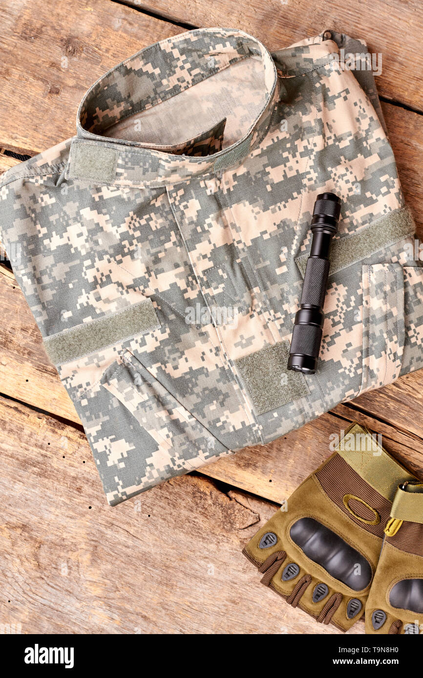 Set of military outfit on brown wooden background, flat lay Stock Photo ...