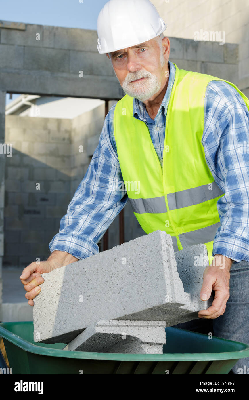 senior man working on block Stock Photo - Alamy