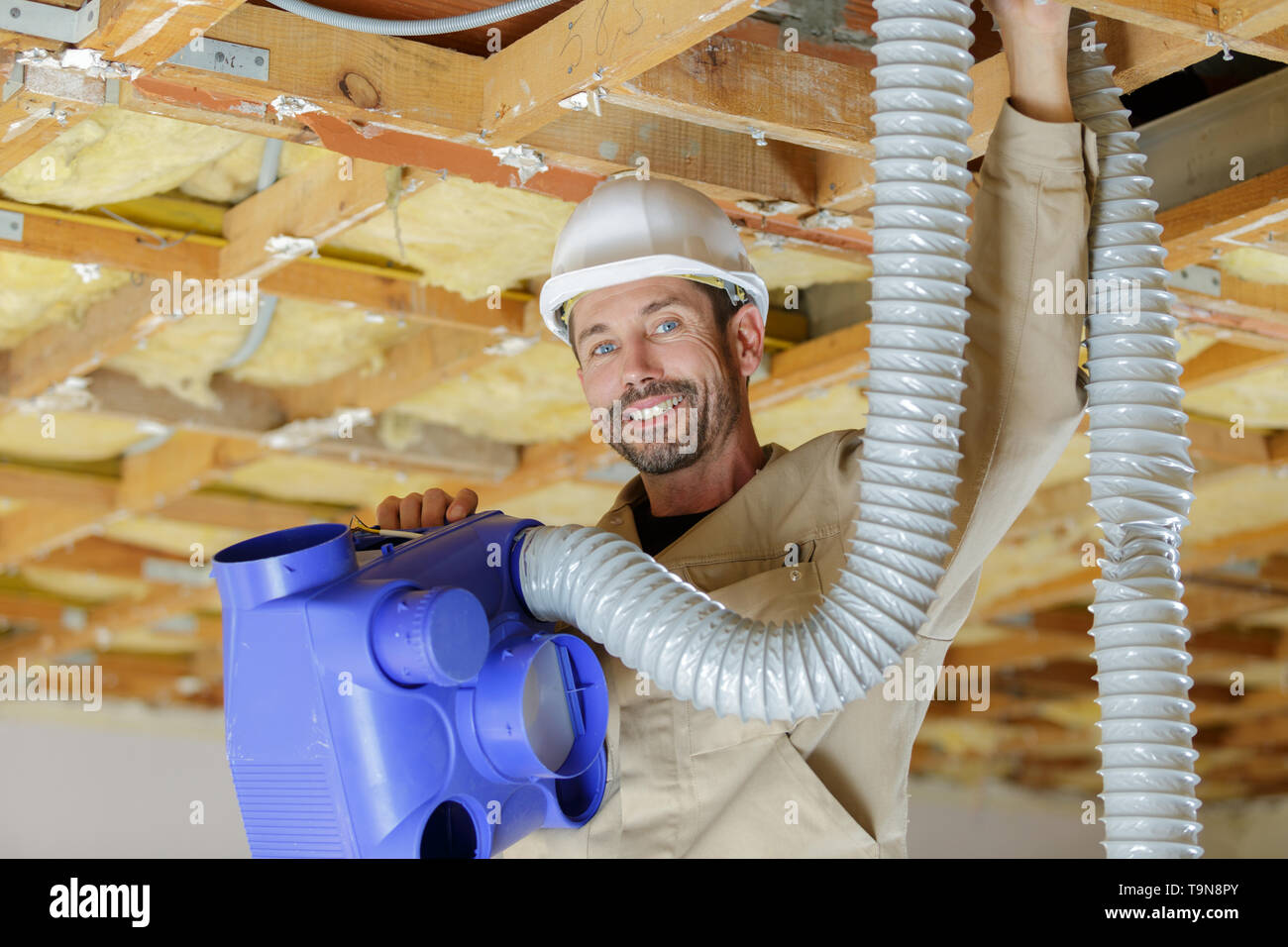 installing ventilation pipe indoors Stock Photo - Alamy
