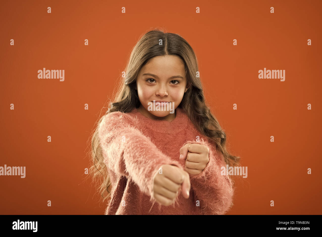 Girl hold fists ready attack or defend. Girl child cute but strong ...