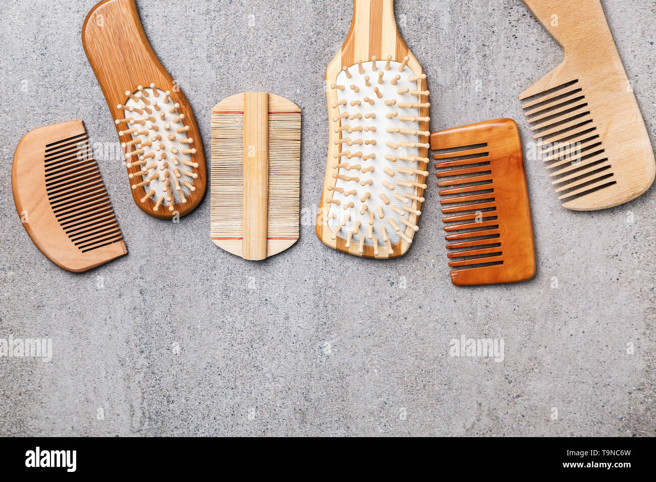 Many different combs and hairbrushes on grey background, flat lay Stock ...