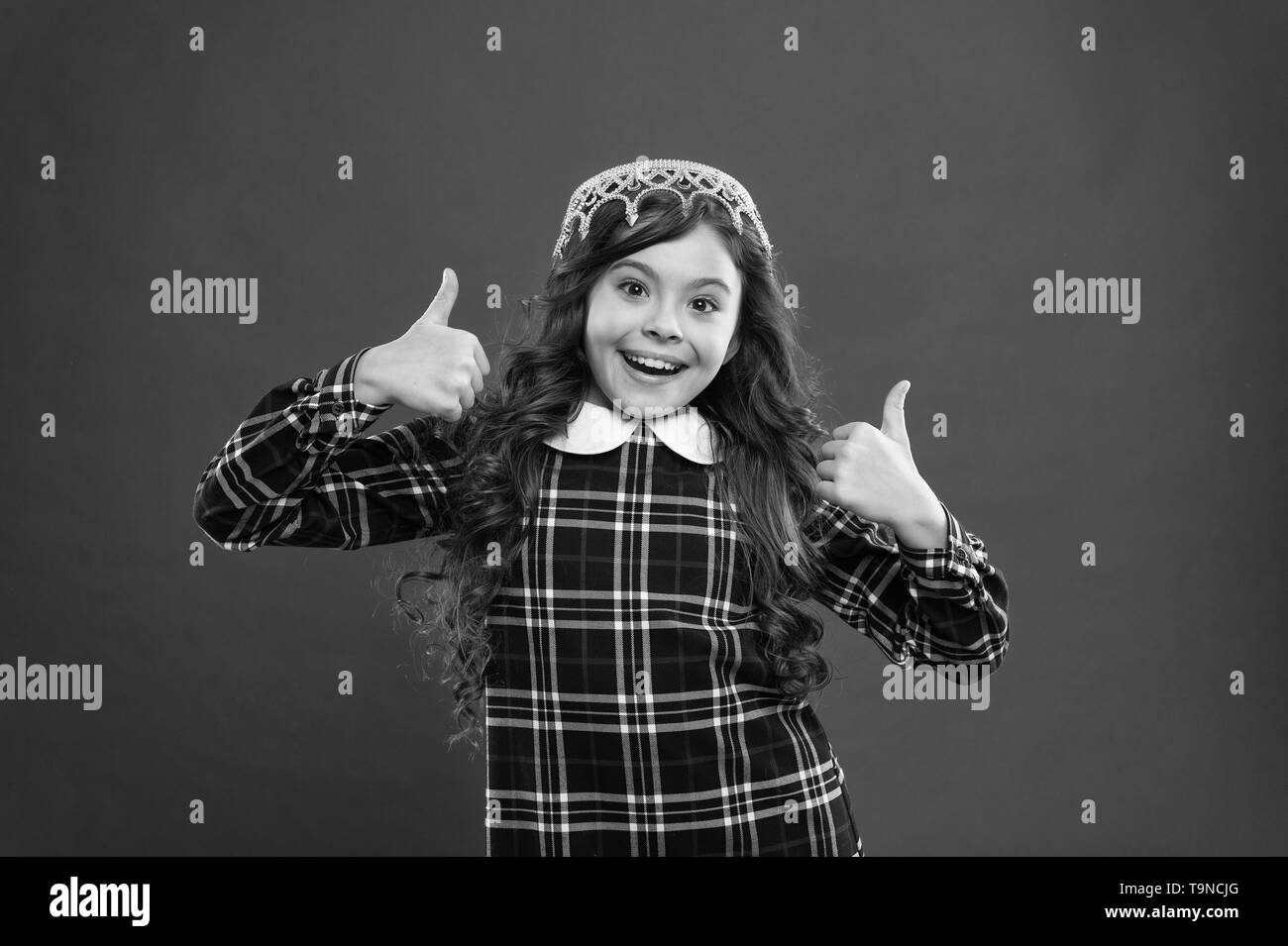 Turn upside down. Kid wear golden crown symbol of princess. Childhood ...