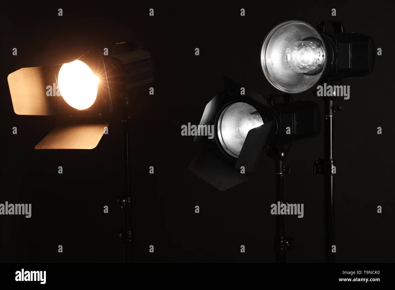 Professional lighting equipment on dark background Stock Photo - Alamy