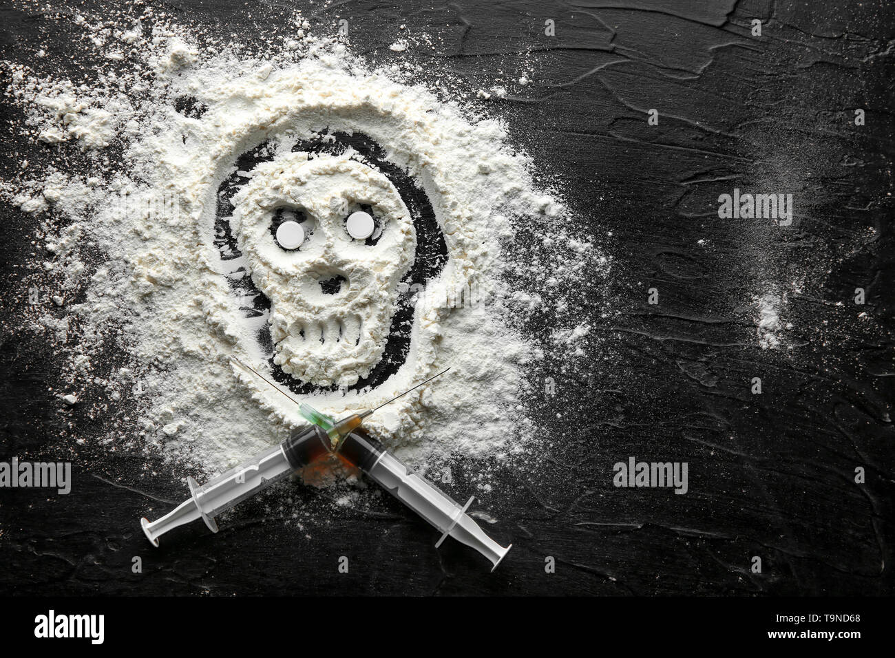 Skull made of drugs and syringes on dark background. Concept of ...