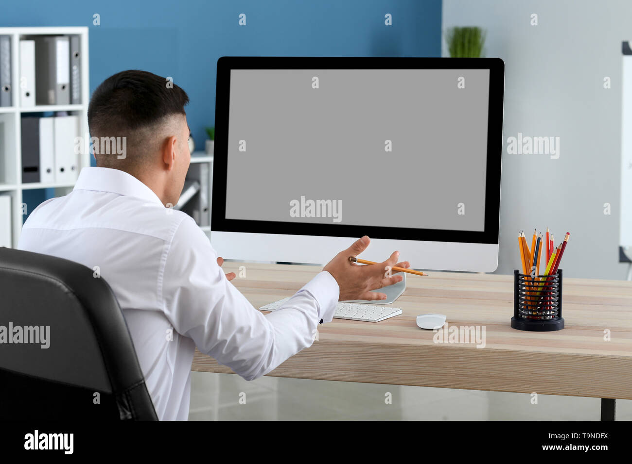 Emotional young man after making mistake during work with computer ...