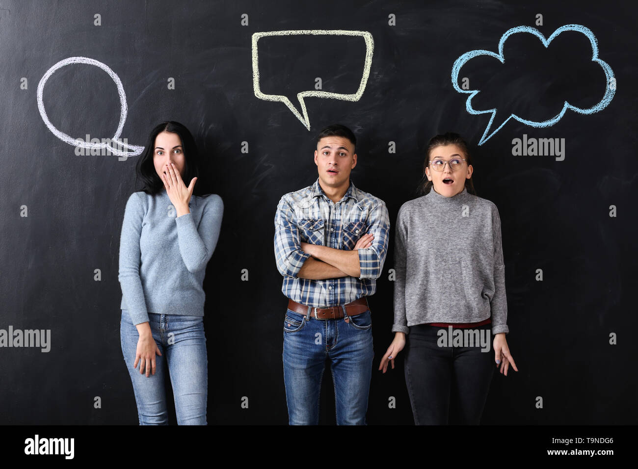 Shocked people and blank speech bubbles on dark background Stock Photo ...