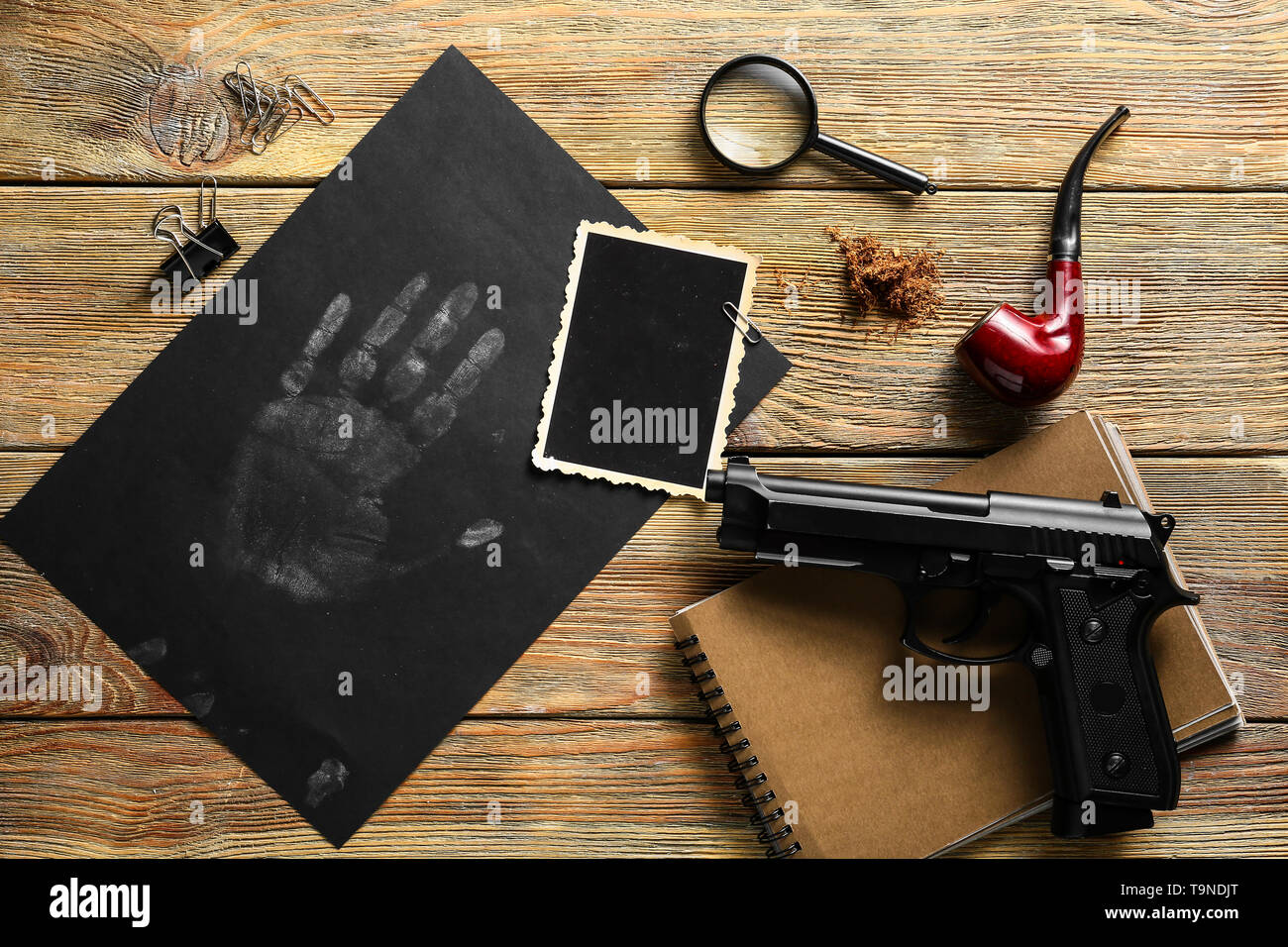 Composition with different items for detective on wooden table Stock ...