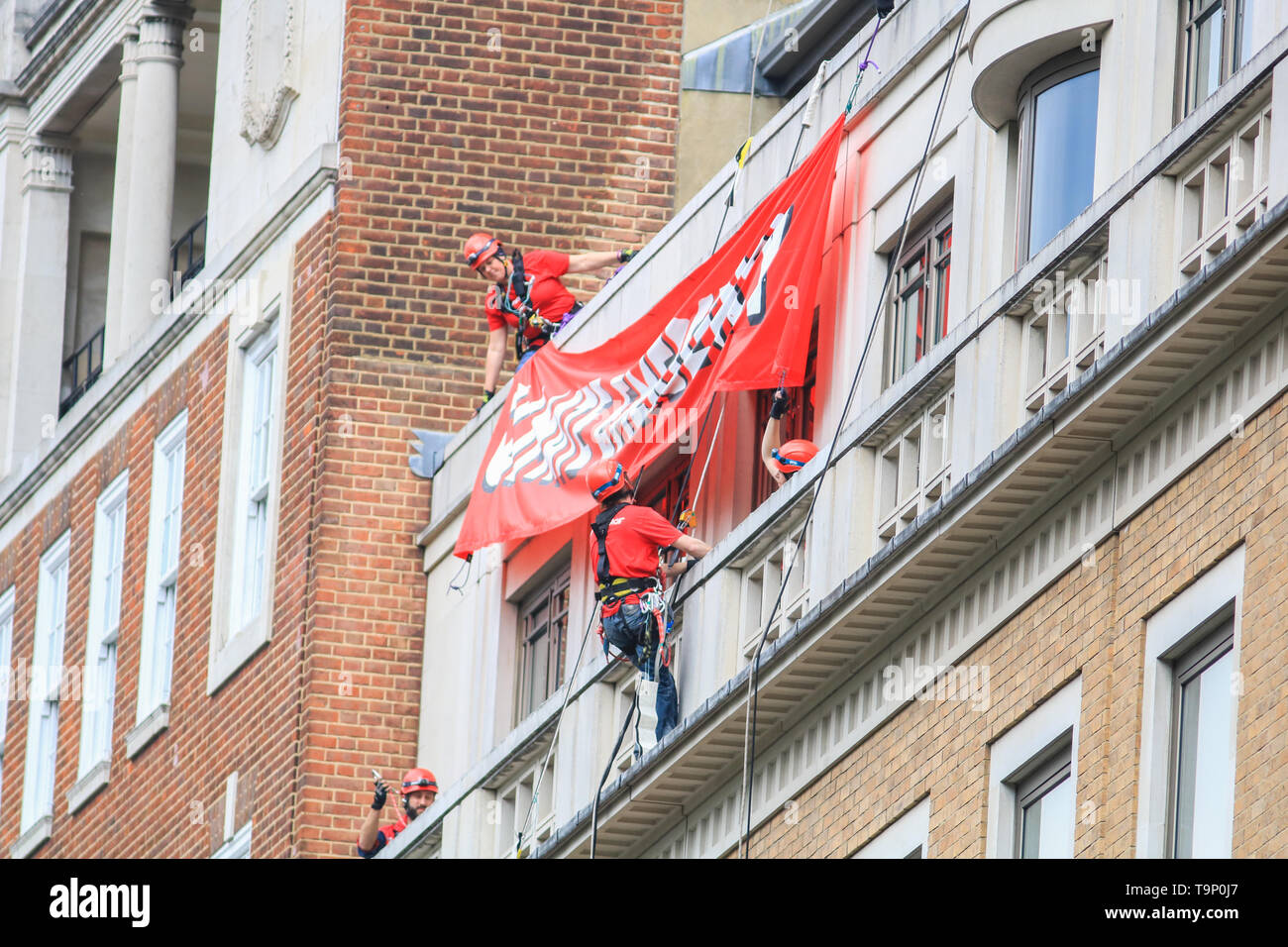 London, UK. 20th May, 2019. Greenpeace climate activists absail from BP ...