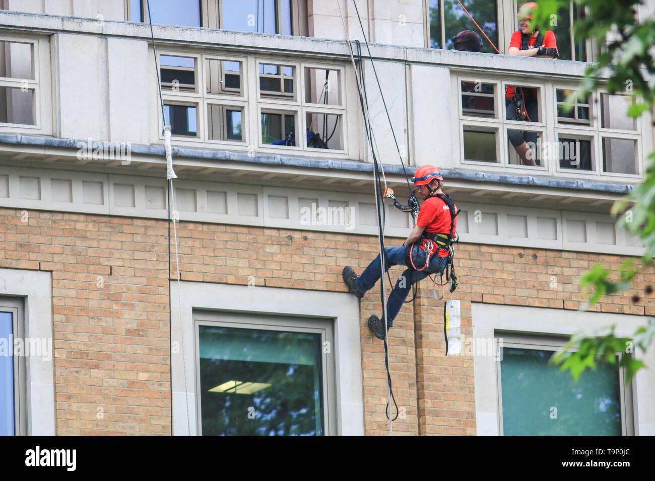 London, UK. 20th May, 2019. Greenpeace climate activists absail from BP ...