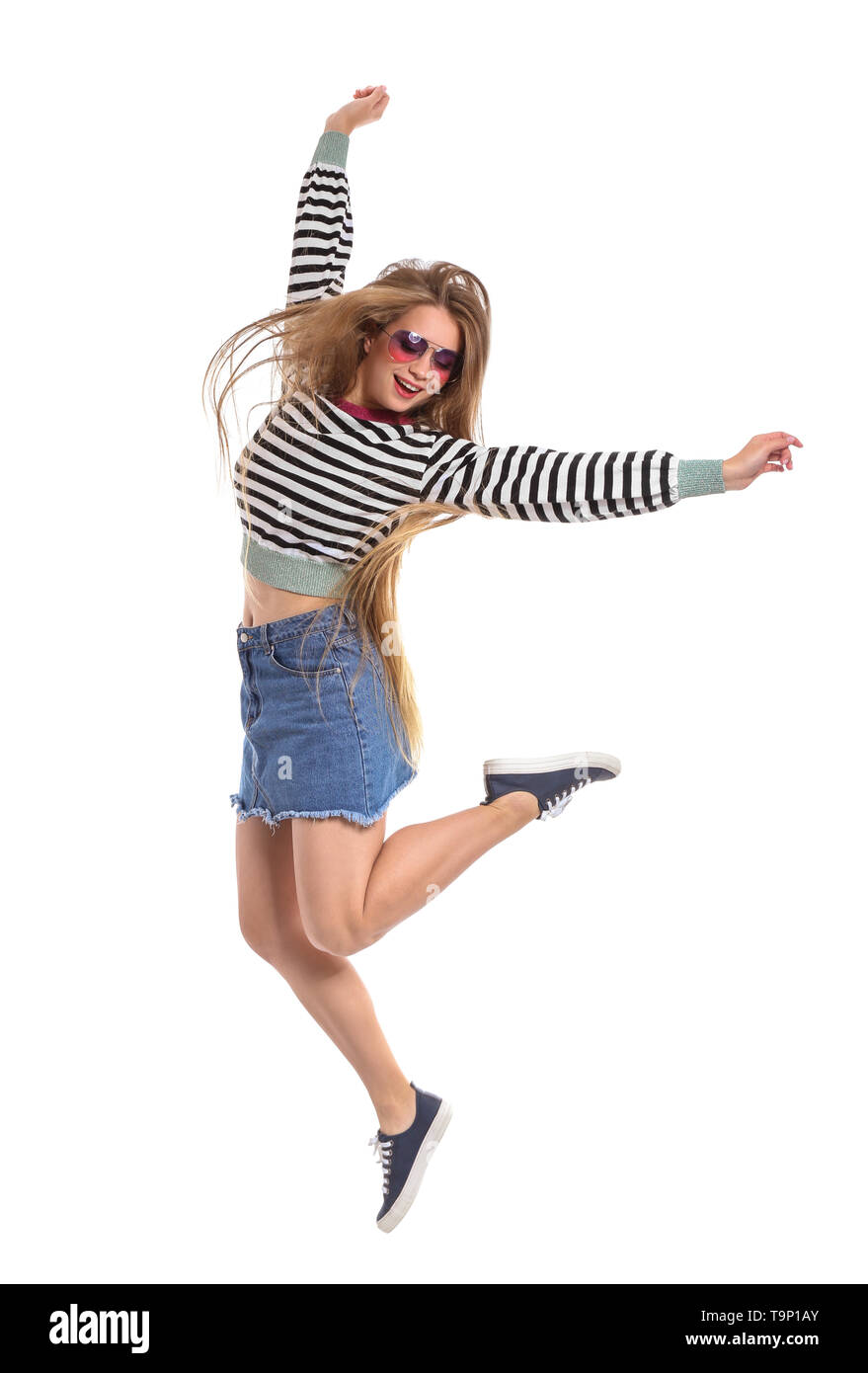 Beautiful young woman dancing on white background Stock Photo - Alamy